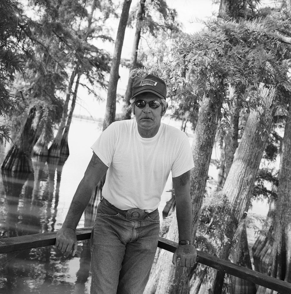 Nolan, a prison trustee, standing in front of the lake, where he ...